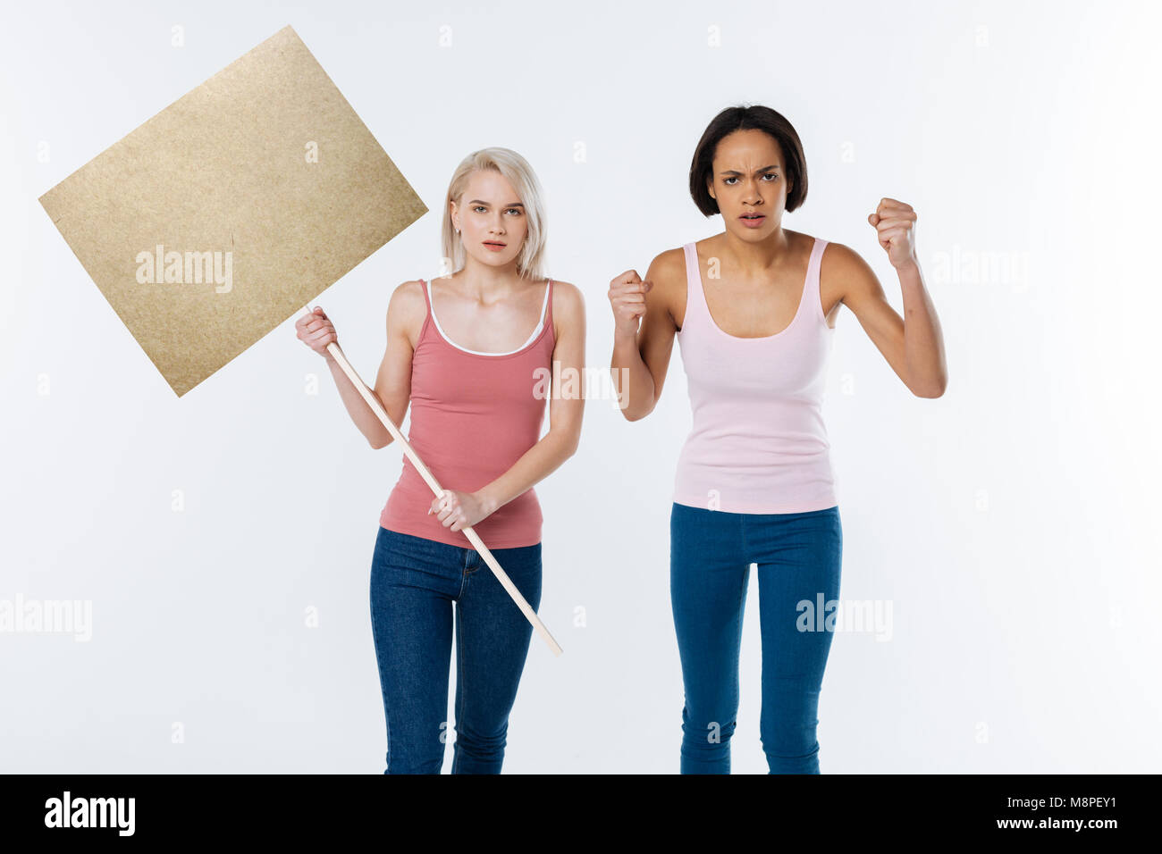 Angry strong woman holding fists Stock Photo - Alamy