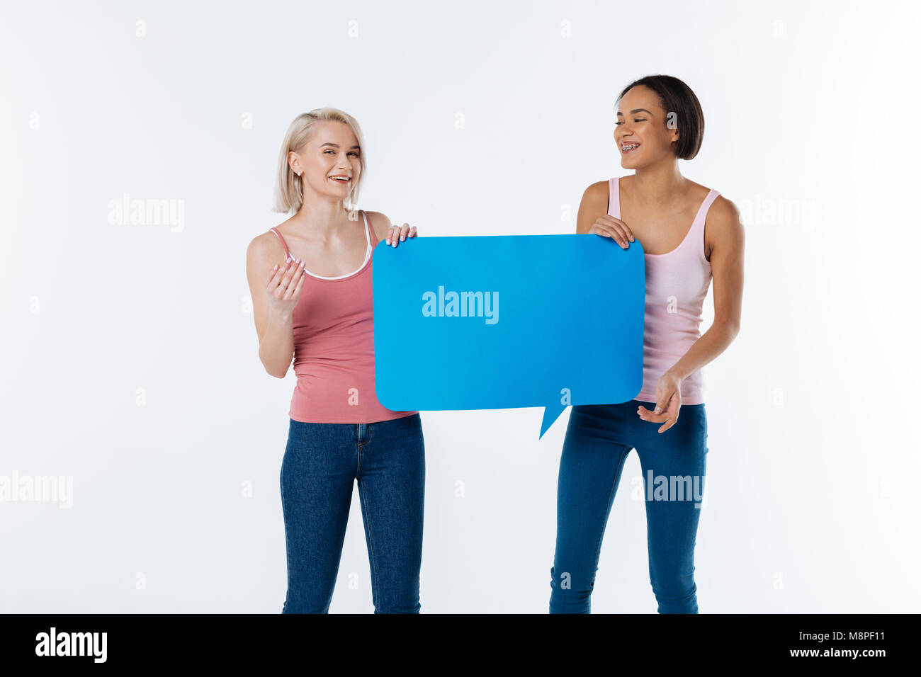 Happy positive women smiling Stock Photo - Alamy