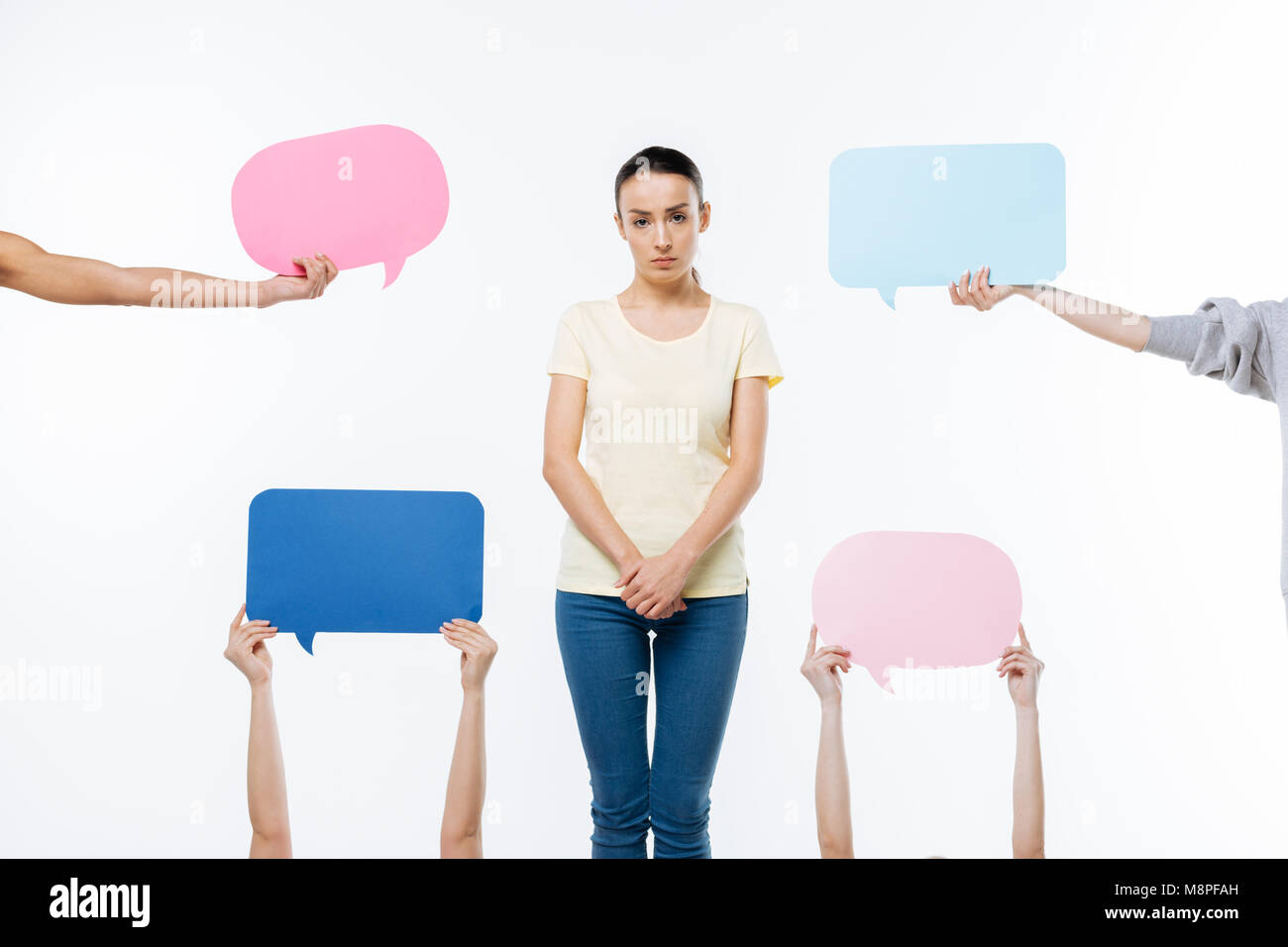 Nice young woman being surrounded by signs Stock Photo - Alamy