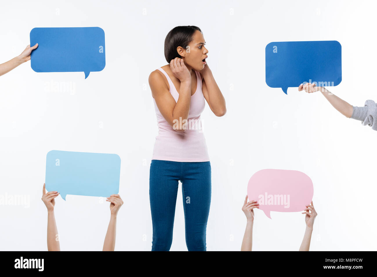 Emotional nice woman being surrounded by signs Stock Photo - Alamy