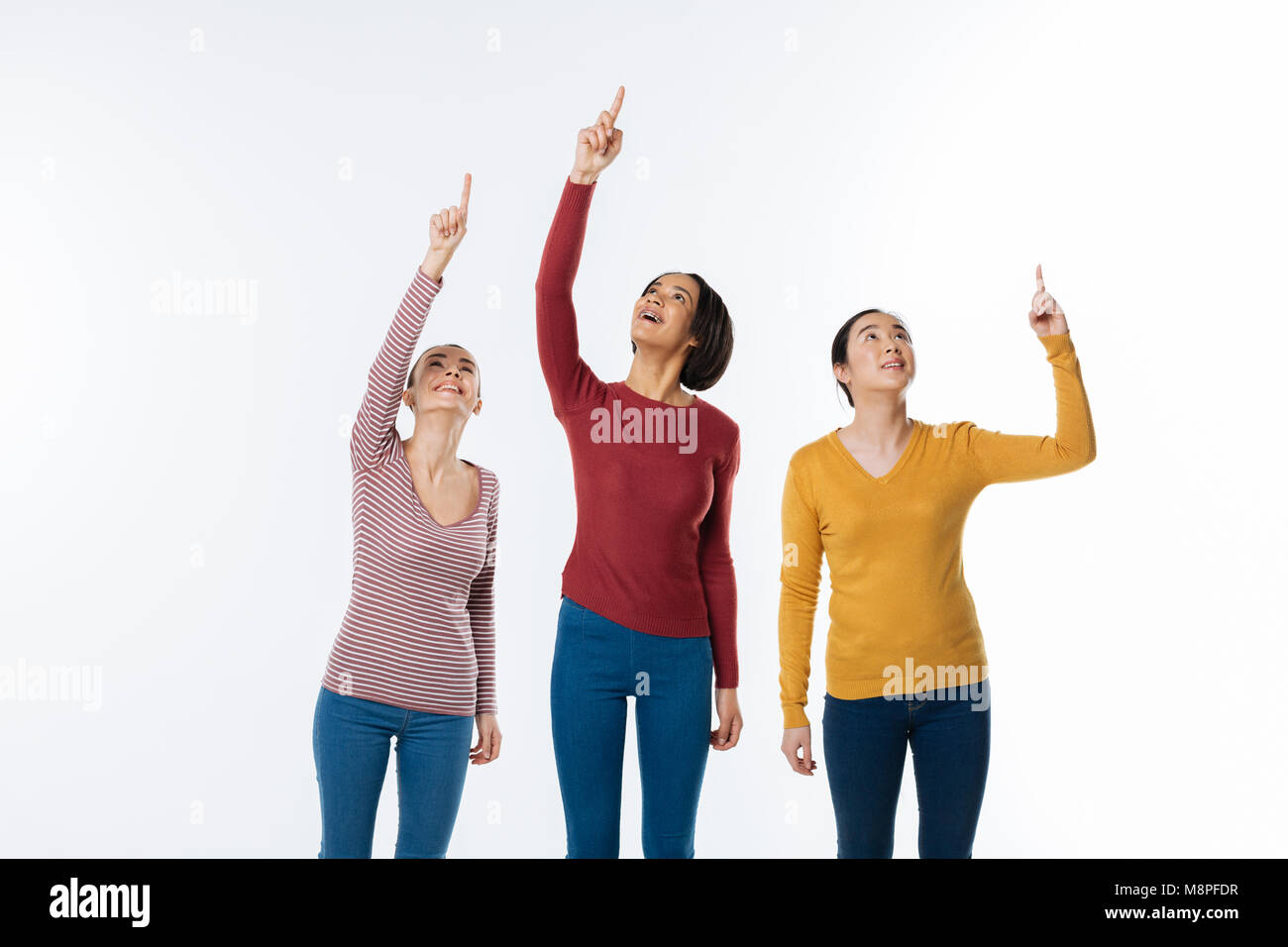 Attractive pleasant women looking up Stock Photo - Alamy