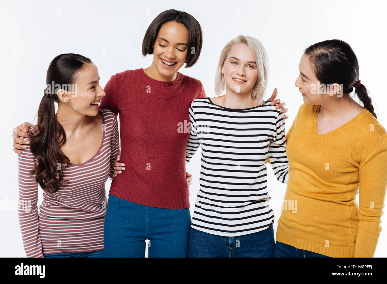 Positive happy women standing together Stock Photo - Alamy