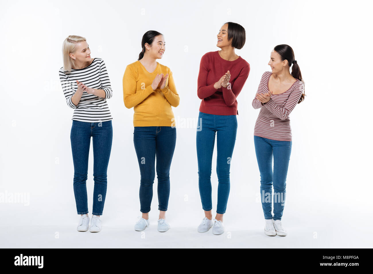 Positive happy women applauding Stock Photo - Alamy