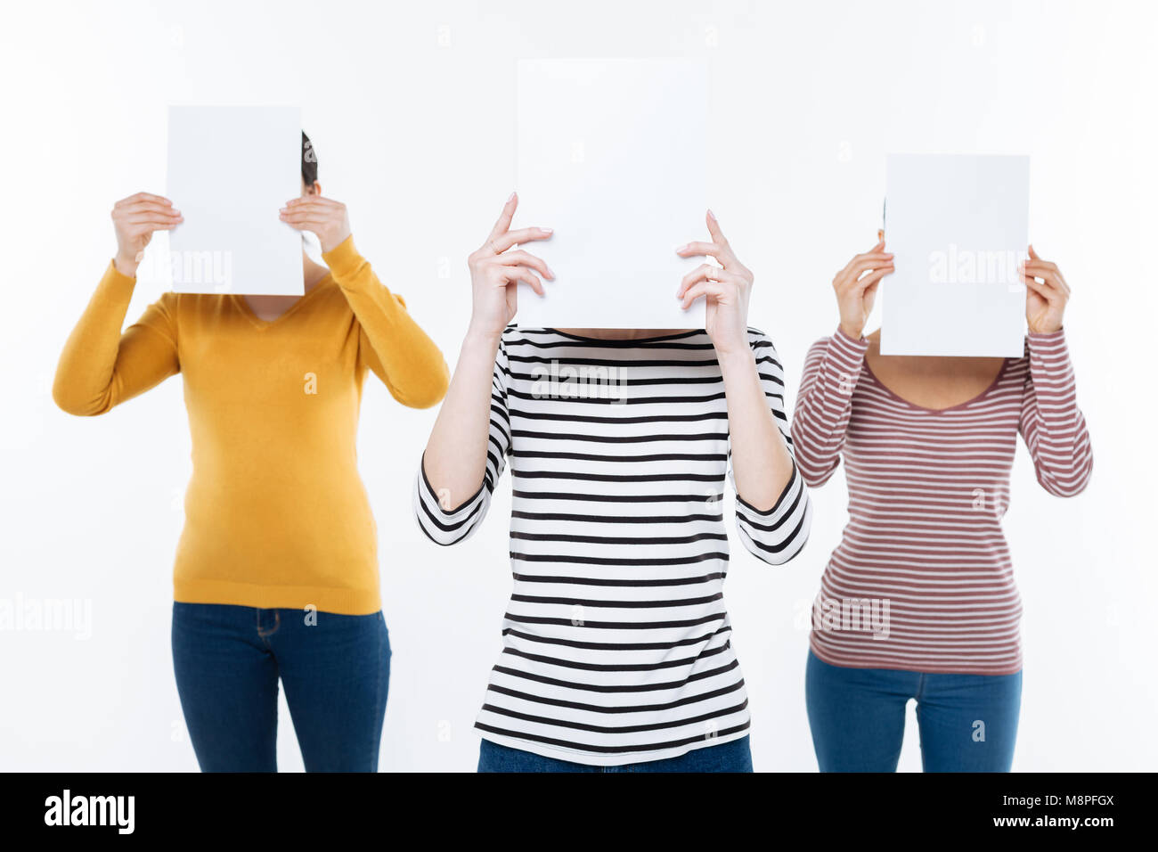 Hiding their faces hi-res stock photography and images - Alamy