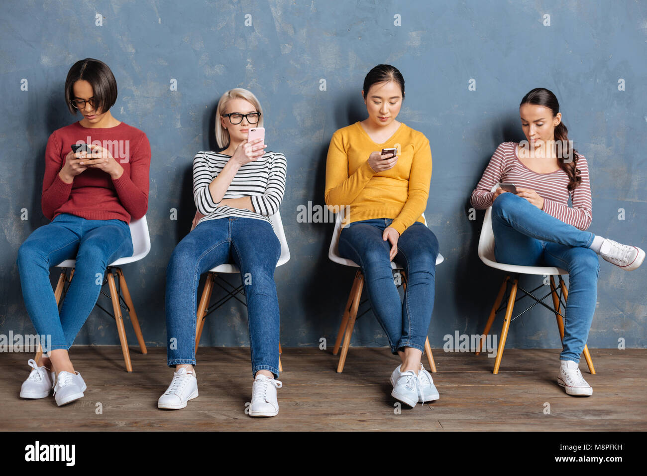 Youth using smartphones not talking hi-res stock photography and images ...