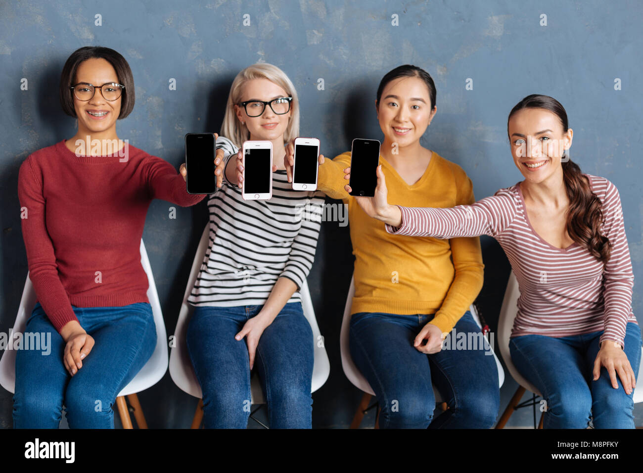 Millennials smartphones hi-res stock photography and images - Alamy