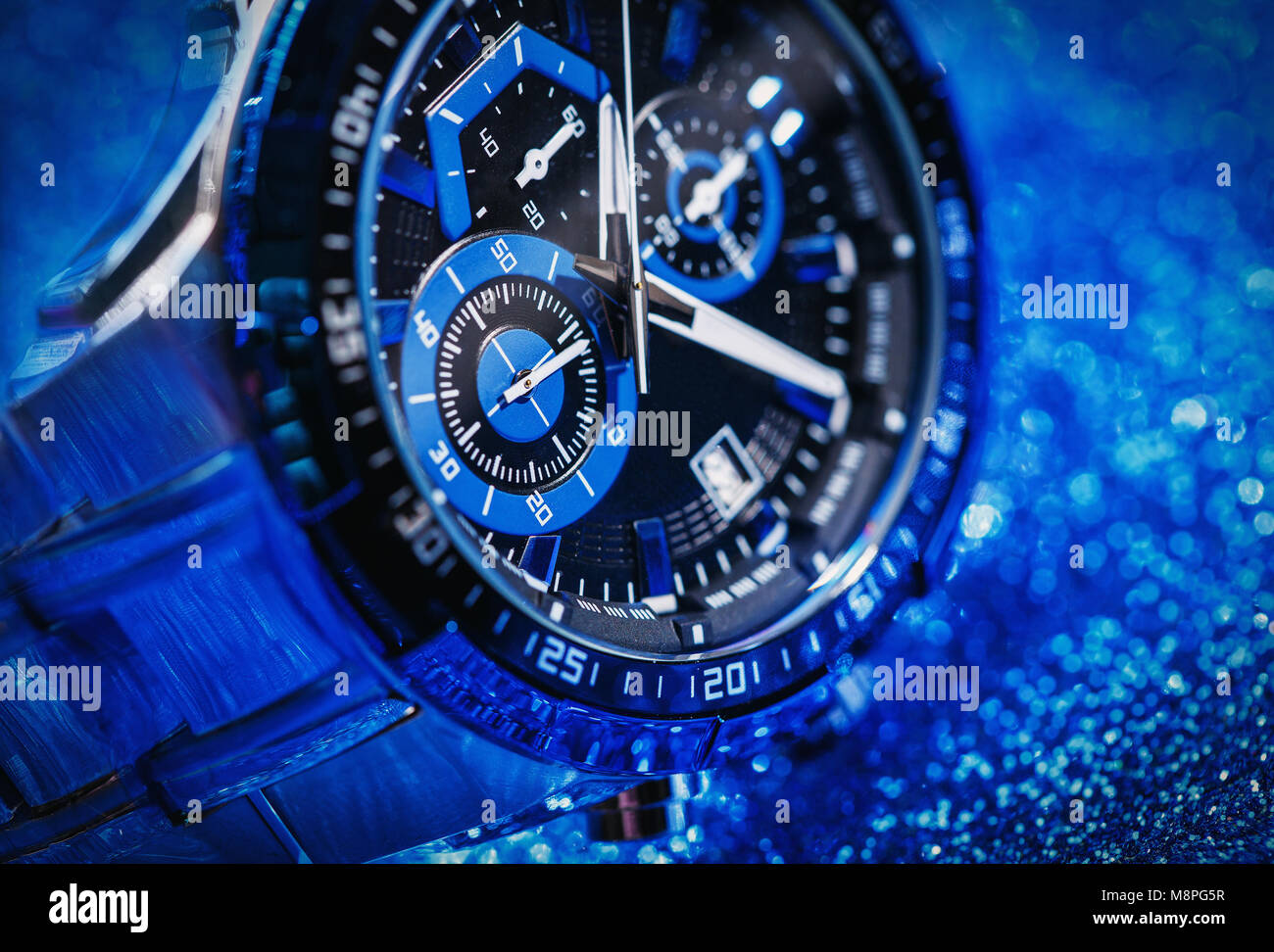 close up view of nice man's wrist watch on blue background Stock Photo ...