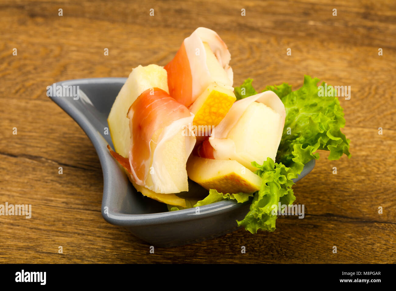 Spanish Hamon with melon Stock Photo - Alamy