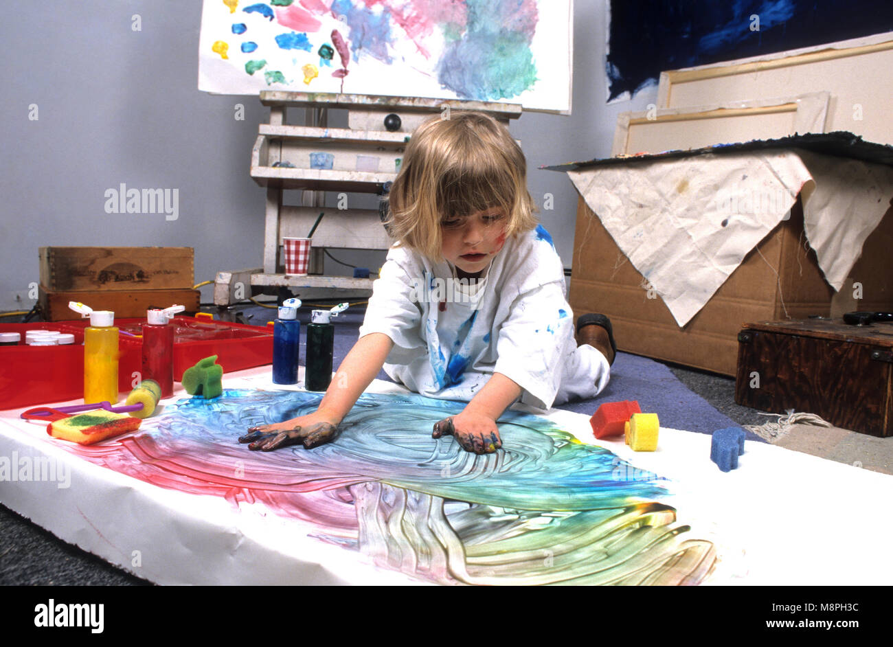 A young female artist fingerpainting, USA Stock Photo - Alamy