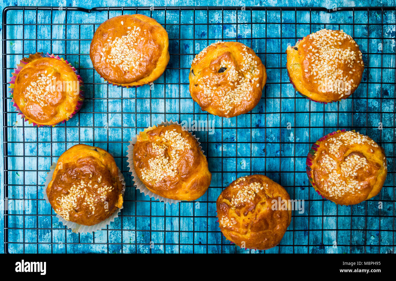 Homemade sesame muffins with seeds and grains on a baking net Stock ...