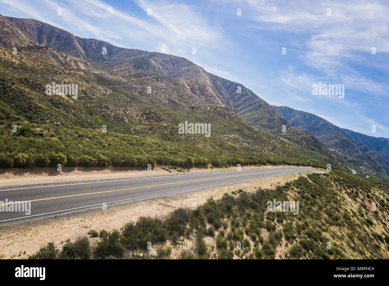 Angled view of a desert road seen from the sky above the Mojave Desert ...
