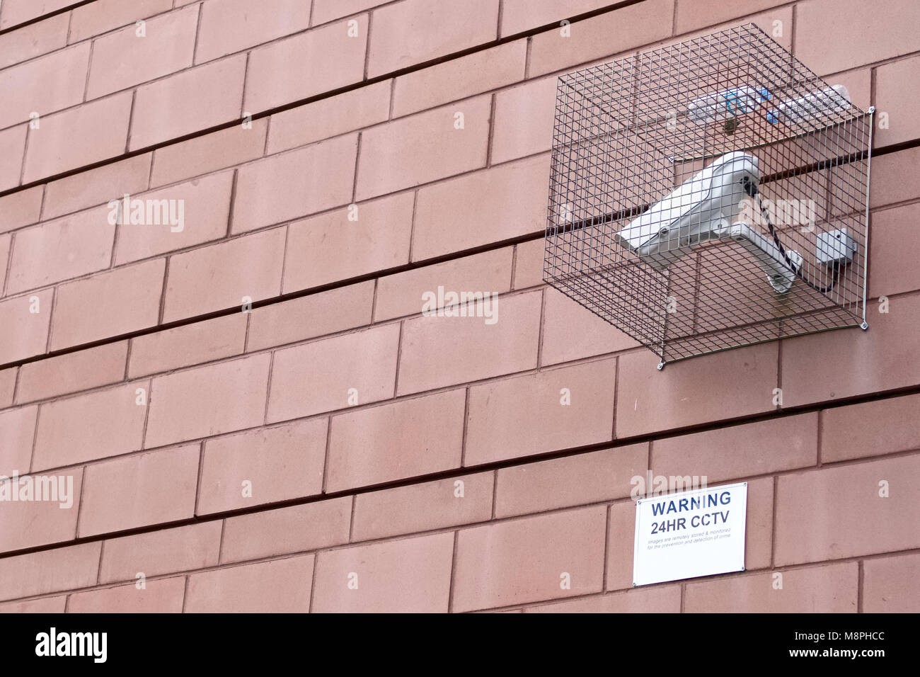 CCTV camera in operation at office wall and sign 24 hour hr operation ...