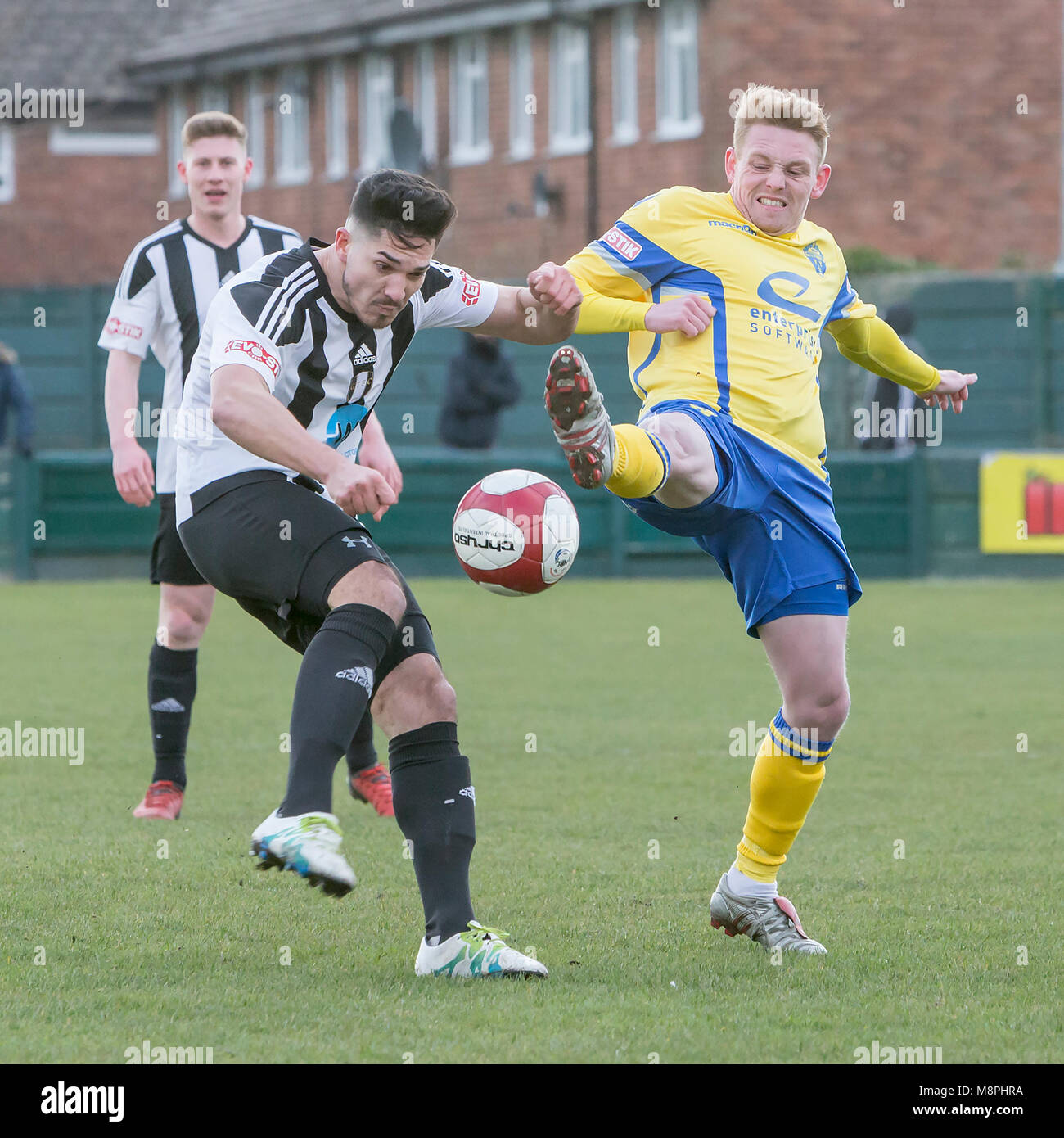 A high kick in an English football match played in the Evo-Stik Premier ...
