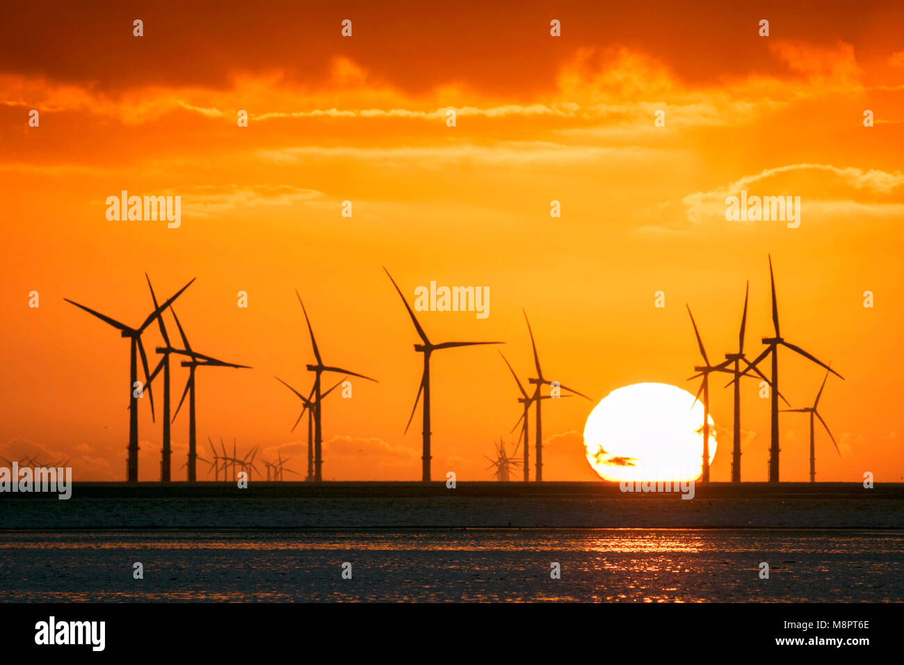 Wind turbines sunset merseyside hi-res stock photography and images - Alamy