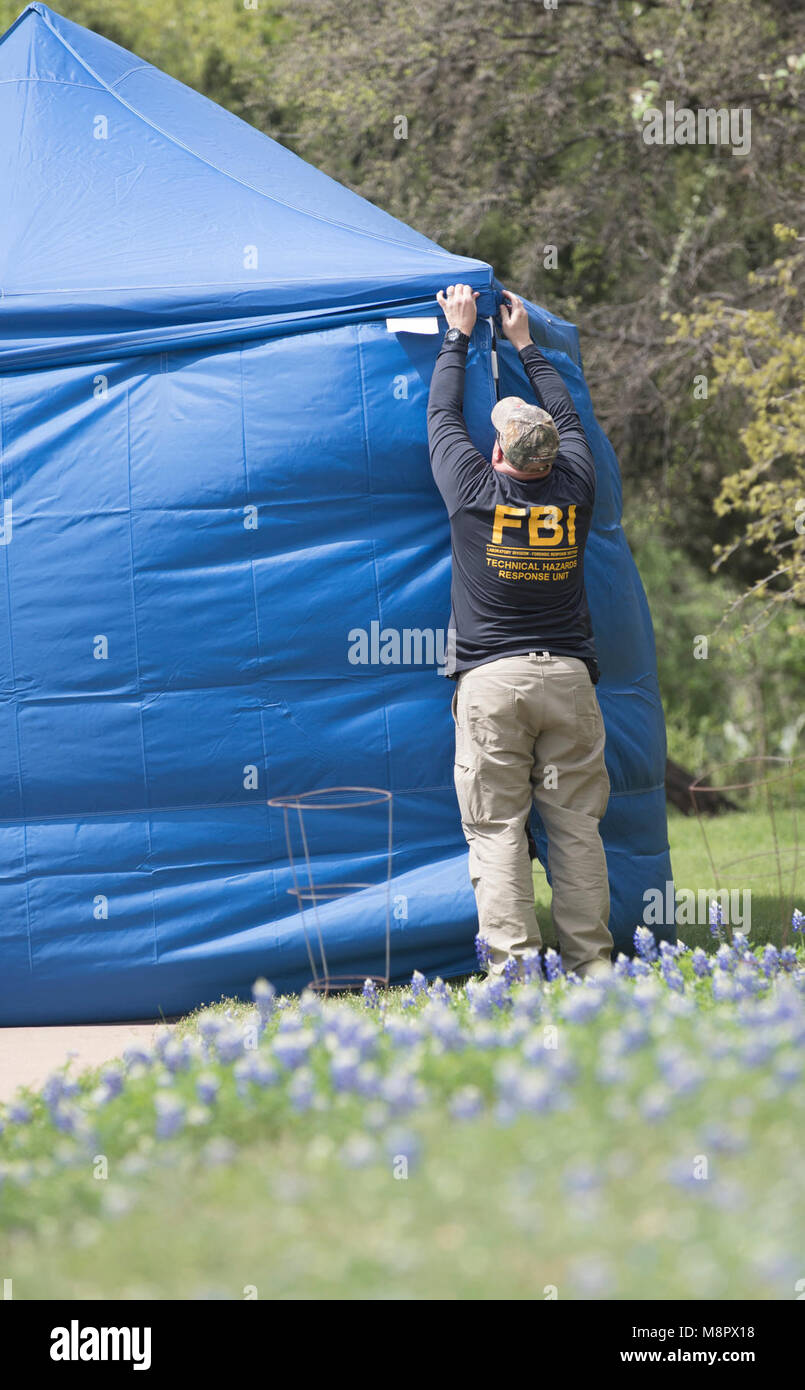 ATF and FBI agents set up a mobile checkpoint in a field of Texas ...