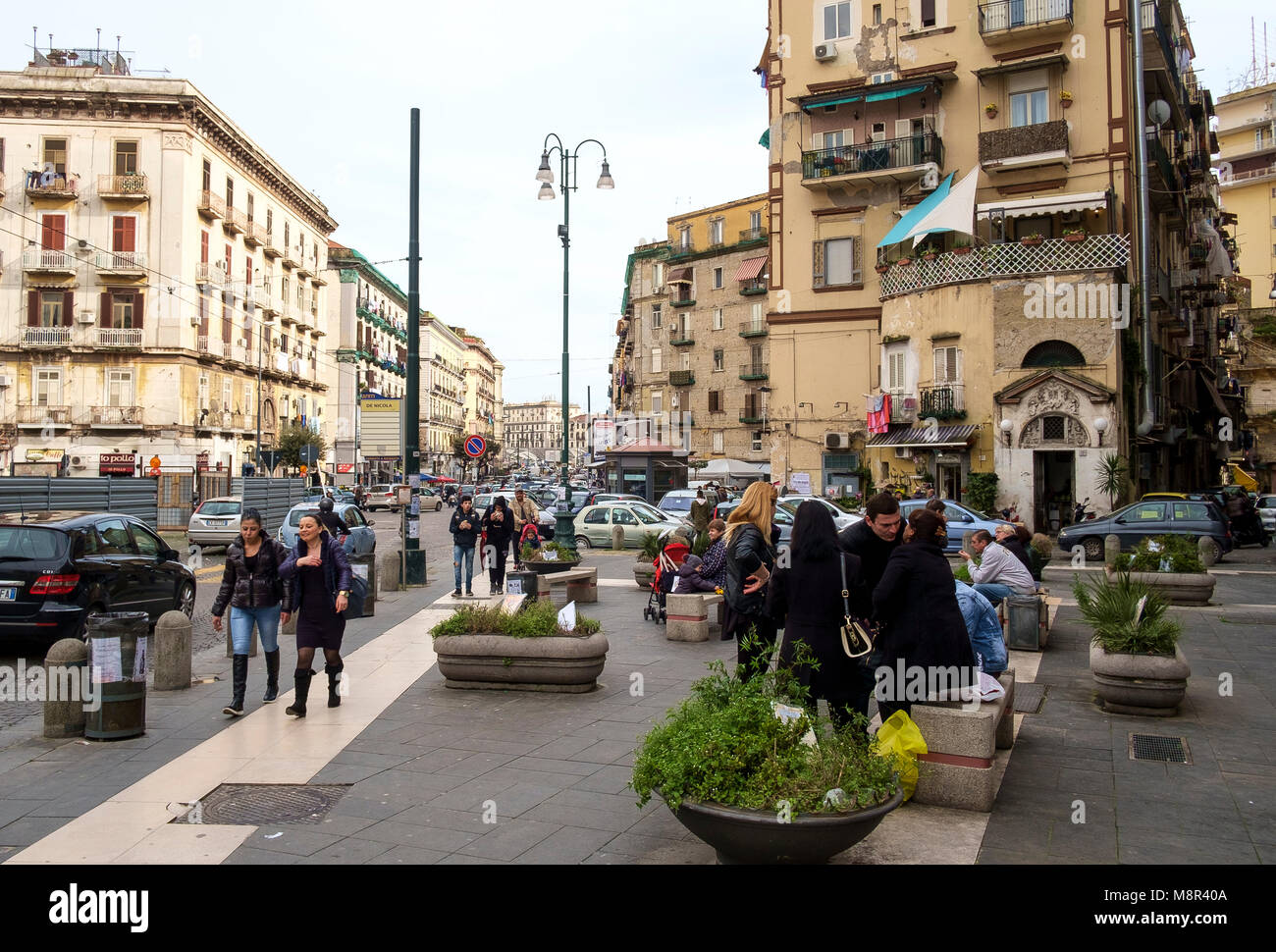 People on Piazza Capuana, in Centro Storico Napoli, opposite Porta ...