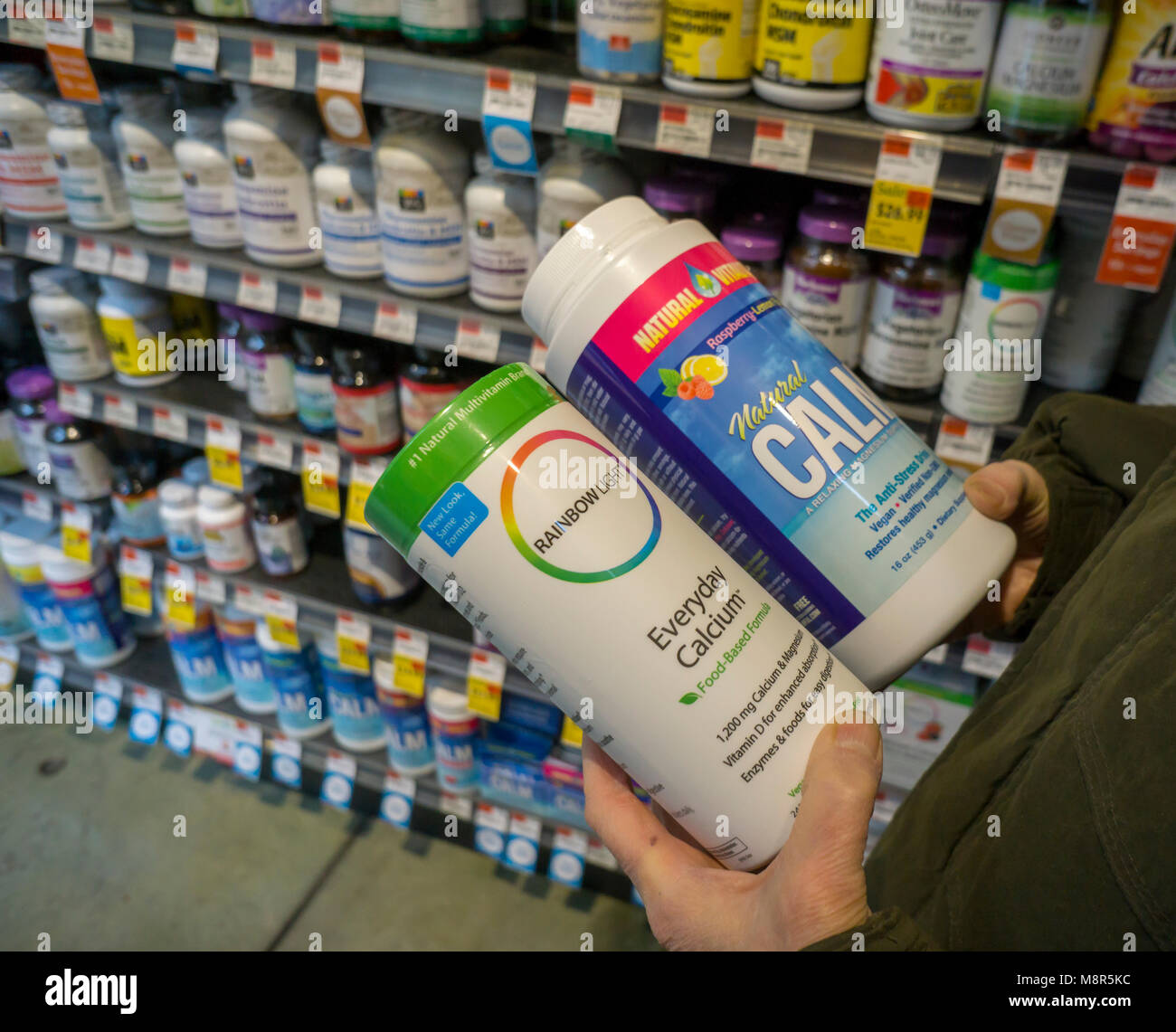 A consumer chooses jars of Natural Vitality brand Natural Calm and ...