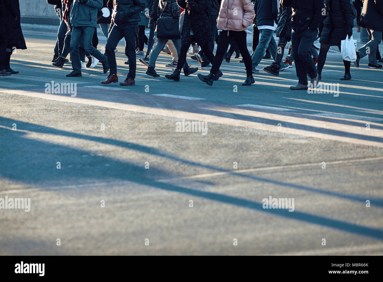 People walking on the street with sunset background Stock Photo - Alamy