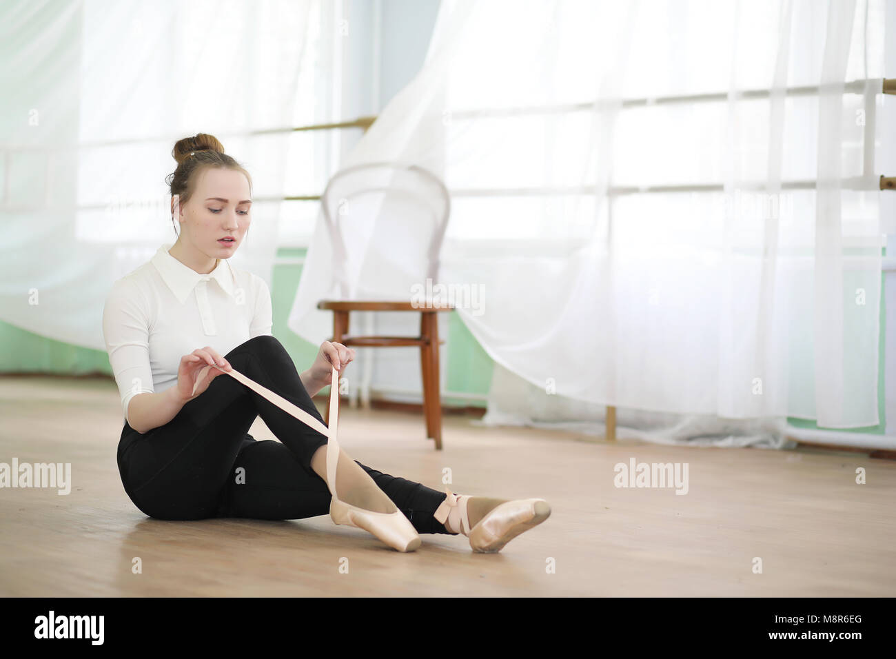 Pretty girl ballet dancer practicing Stock Photo - Alamy