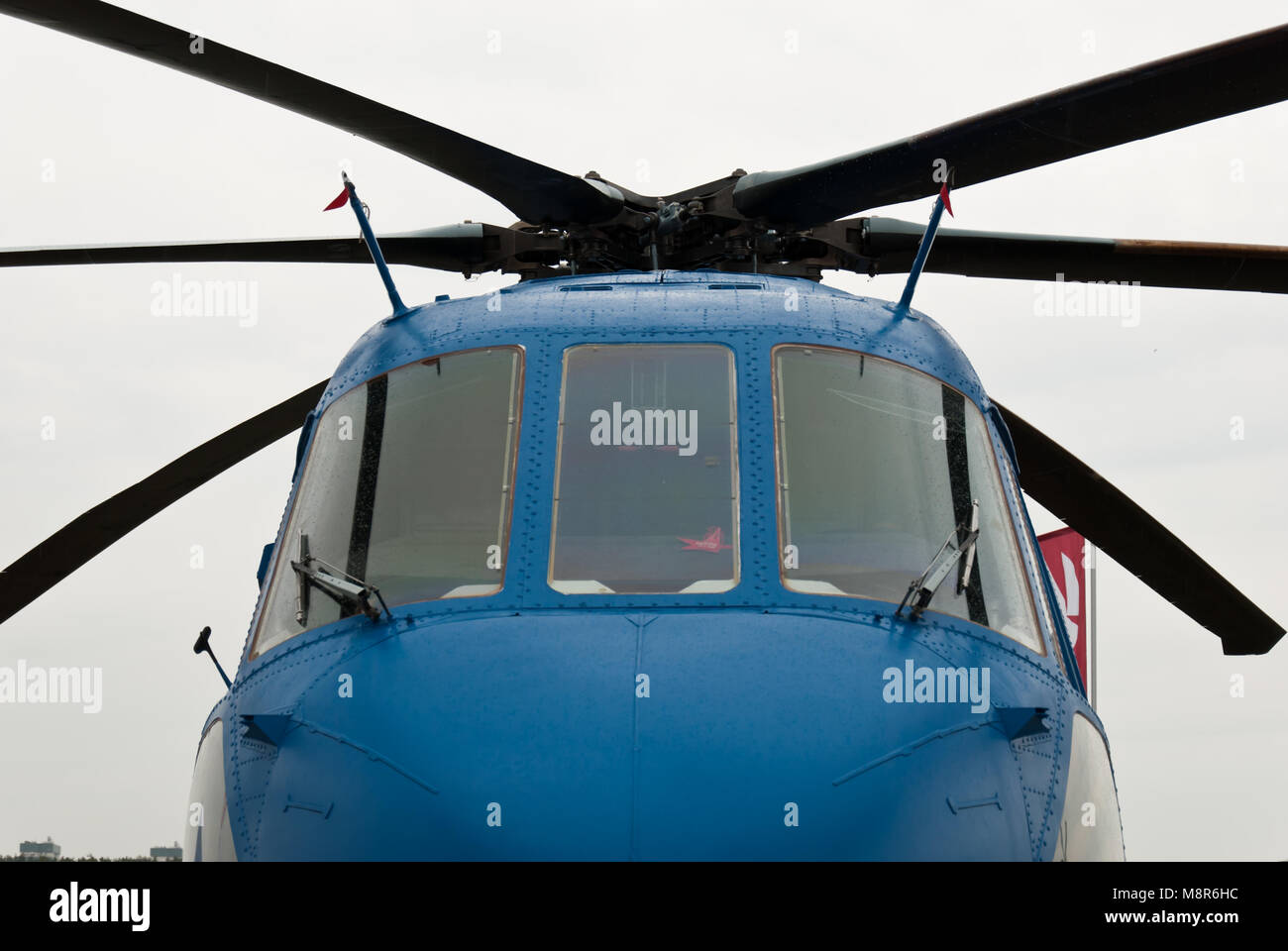 A military aircraft - helicoper against blue sky Stock Photo - Alamy