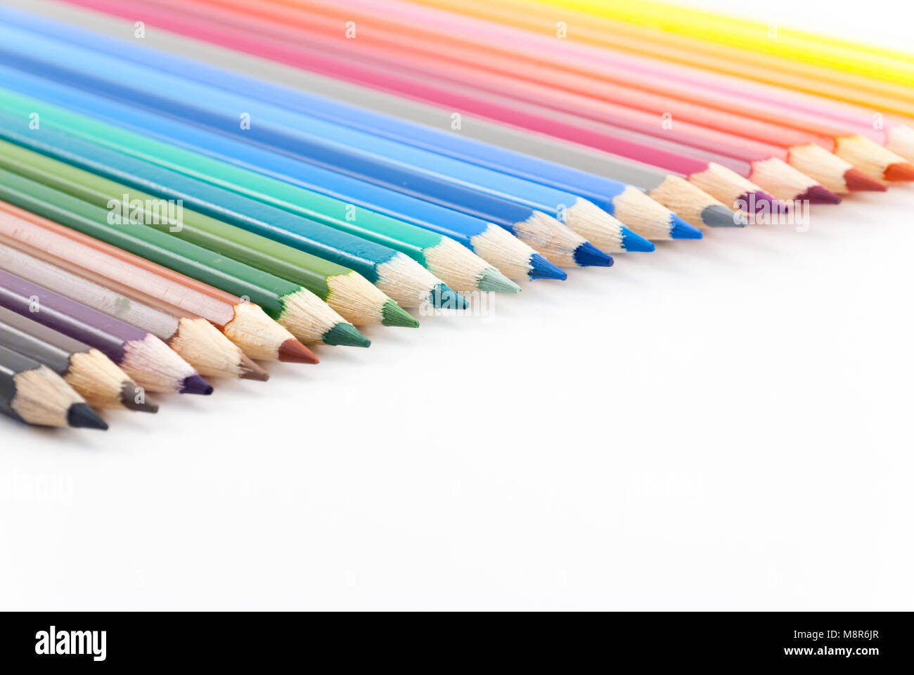Number of colored pencils on white background Stock Photo - Alamy
