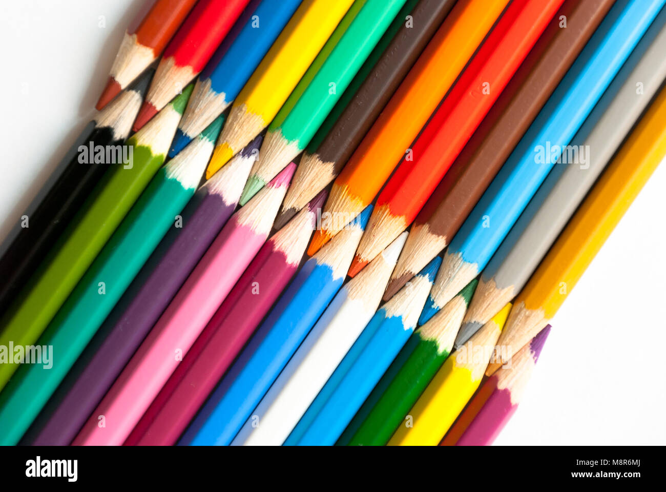 Number of colored pencils on white background Stock Photo - Alamy