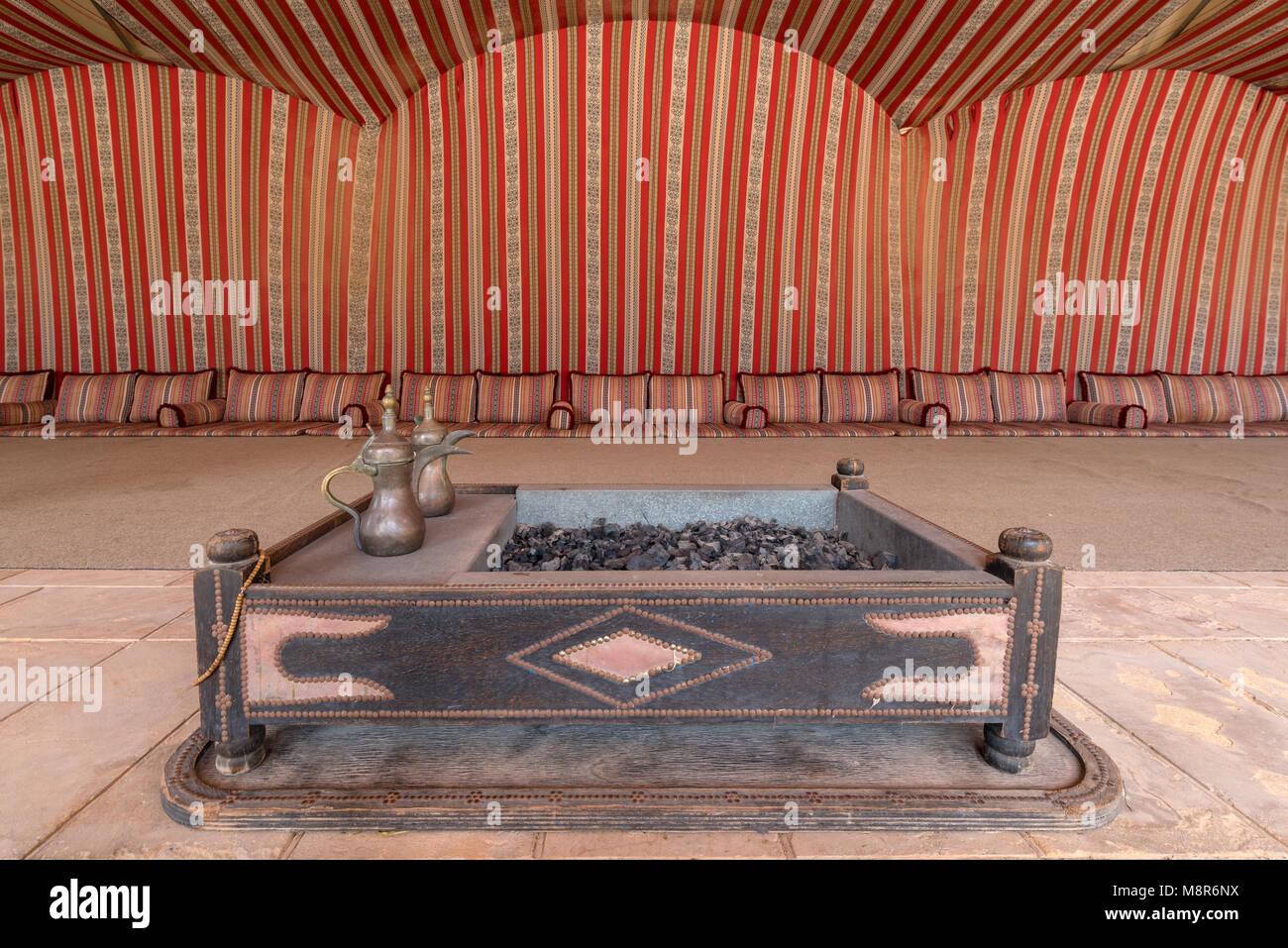 Interior of a large traditional arab tent lined with red patterned ...