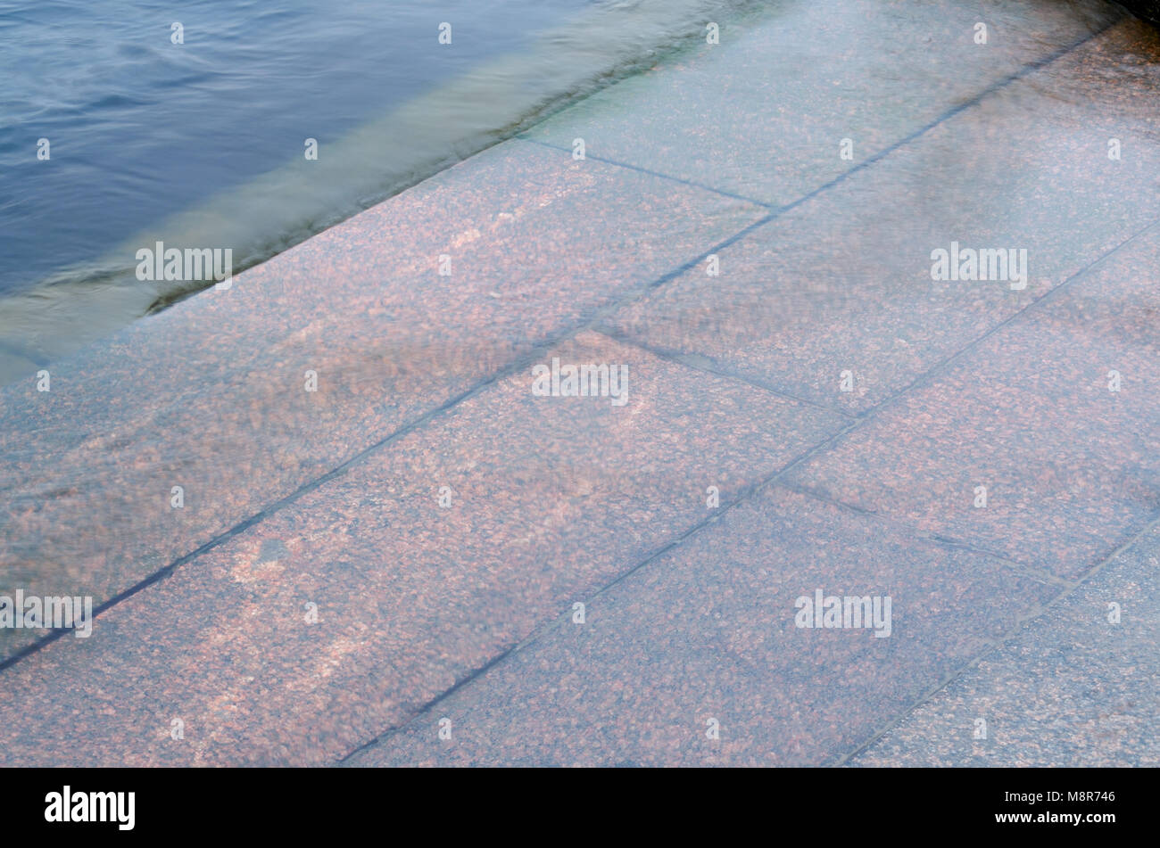In the river rose the water level. granite embankment, washed by her ...