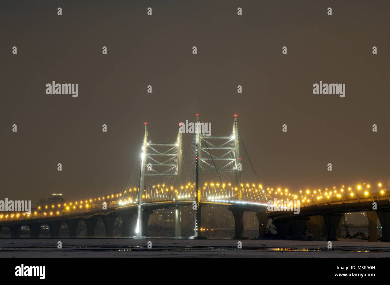 Cable-stayed bridge at night.In the darkness shines the electric light ...