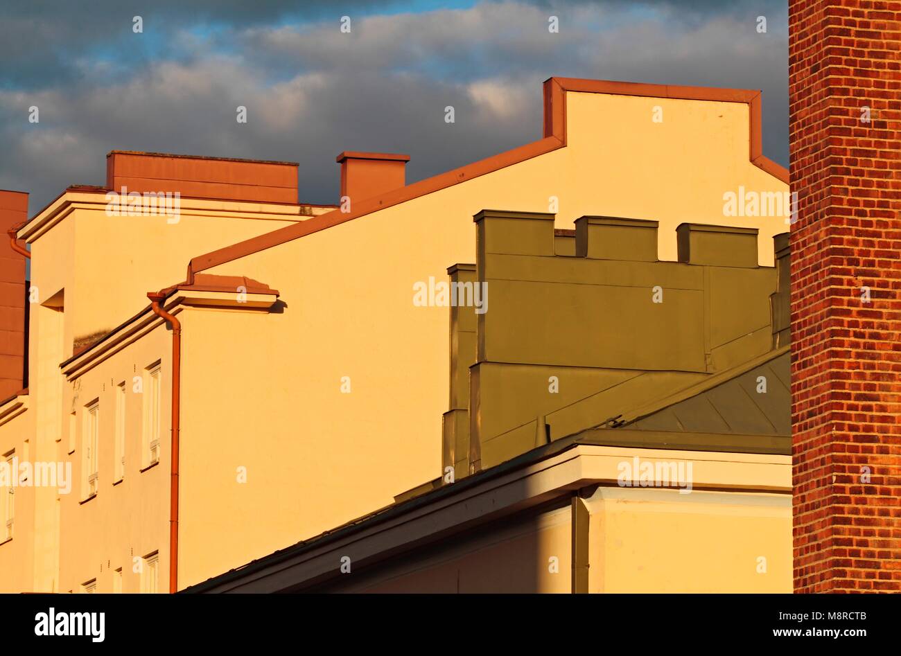 Pipes and chimneys over the building rooftops Stock Photo - Alamy