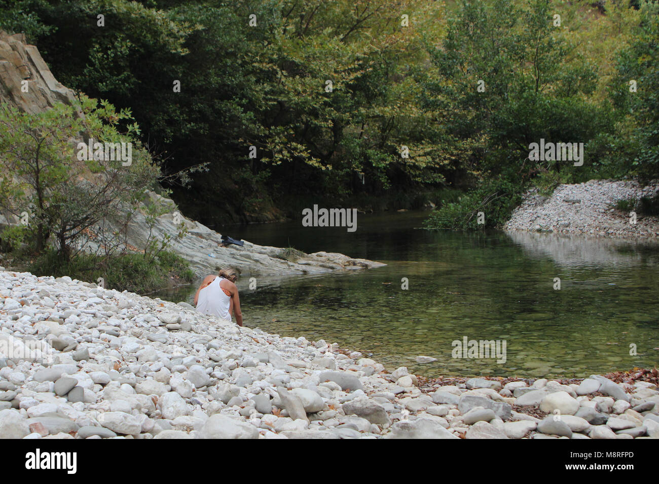 Young alone fairy woman dressed in white at summer standing alone at ...