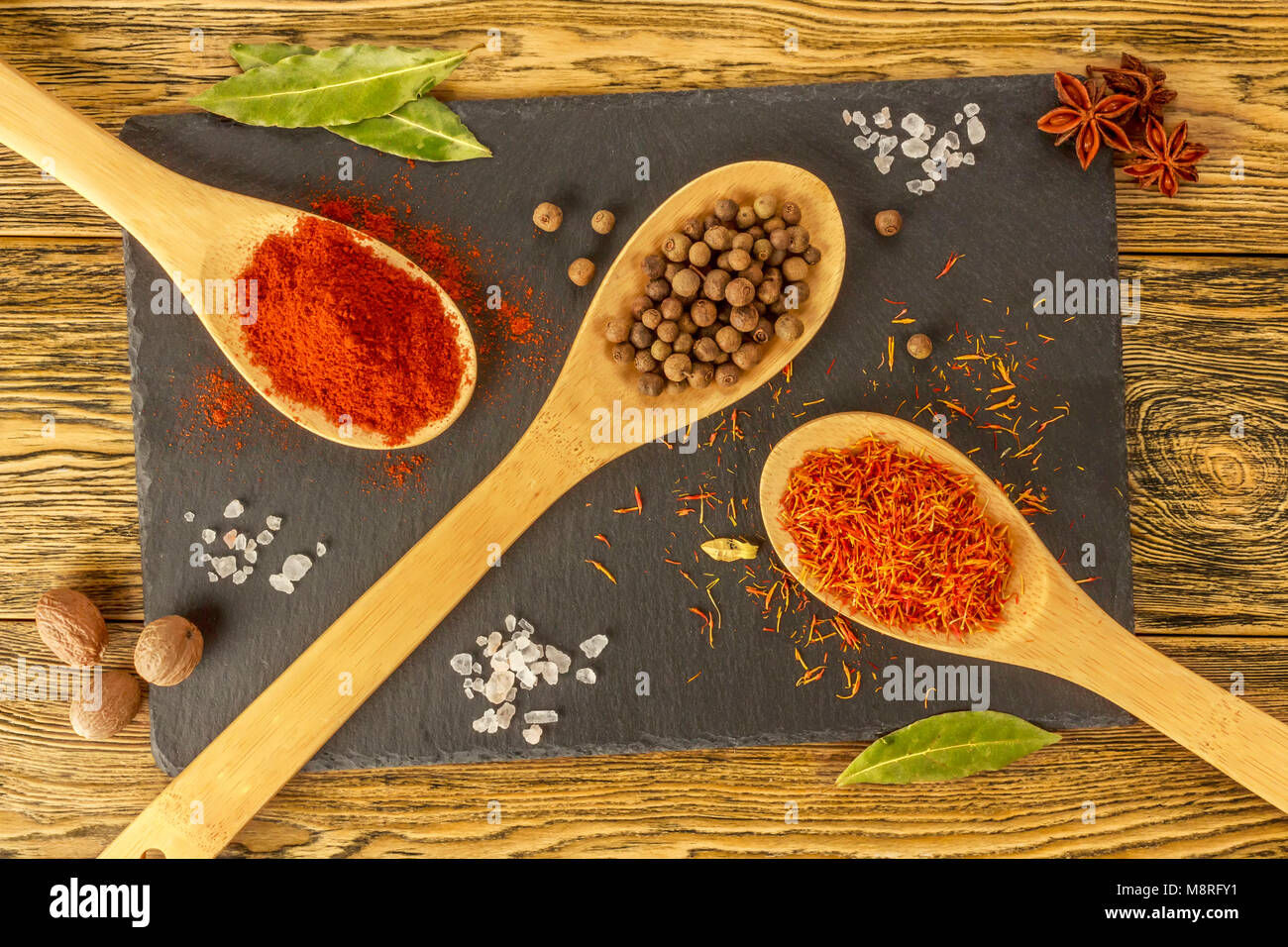 Composition of spices. Seasonings on the kitchen table. Slate Board and ...