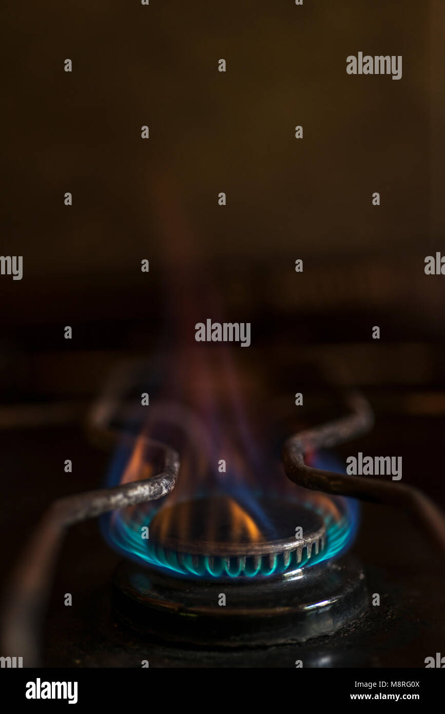 burned burner from a kitchen with blue butane gas fire Stock Photo - Alamy