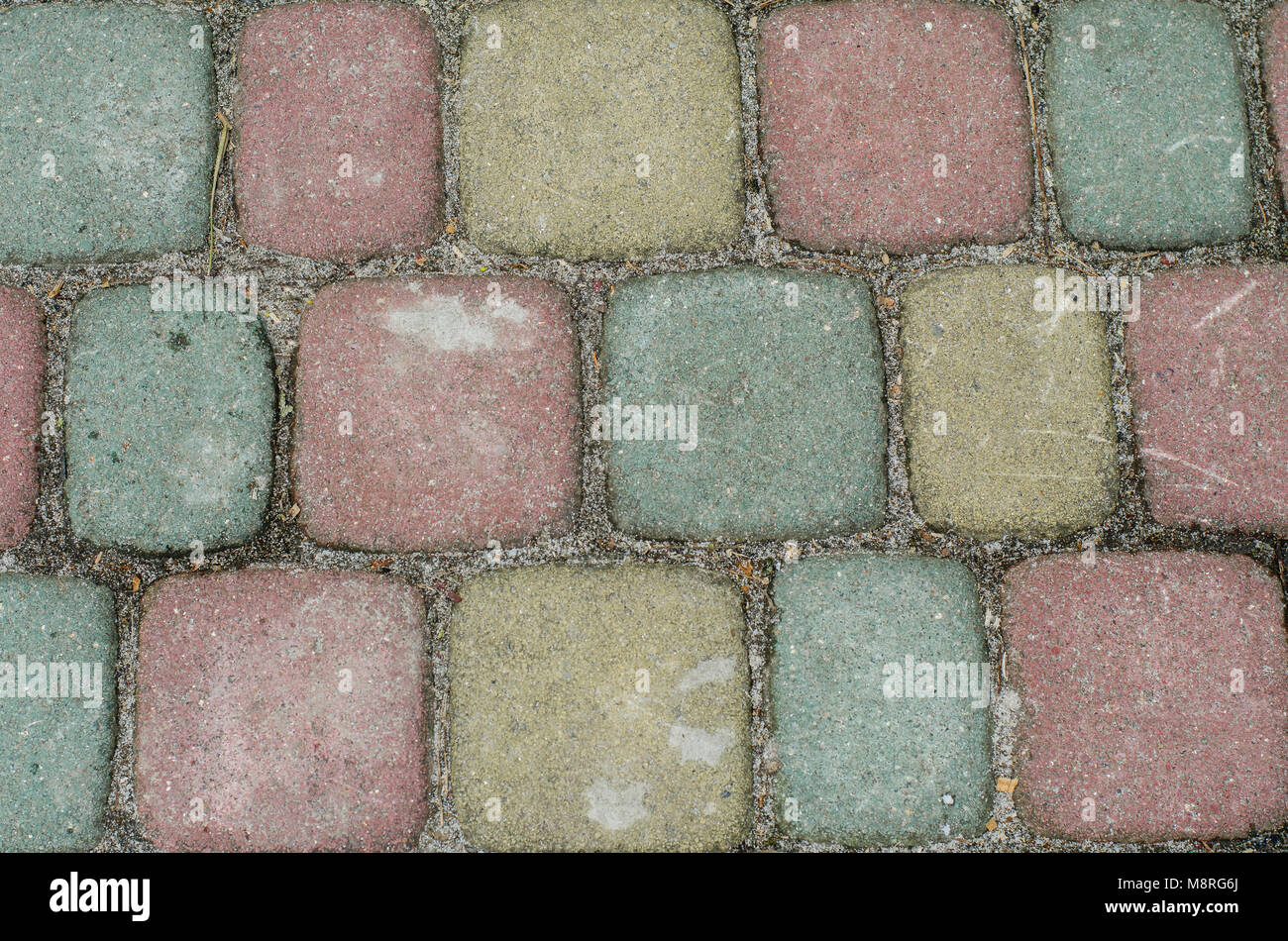 Texture of multi-colored cobblestone road. Concrete, cobbles grey ...