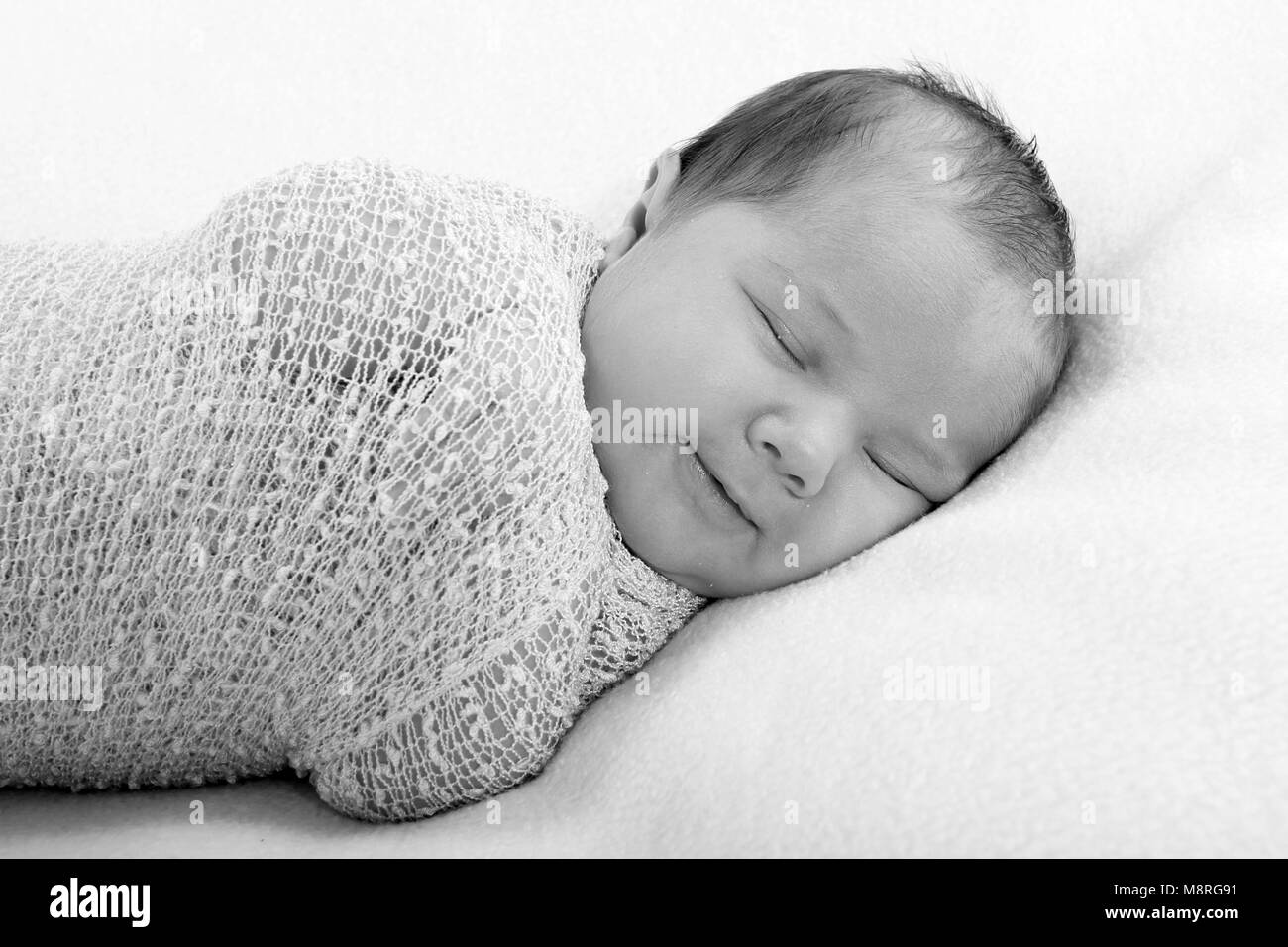 Swaddled baby wrap hi-res stock photography and images - Alamy