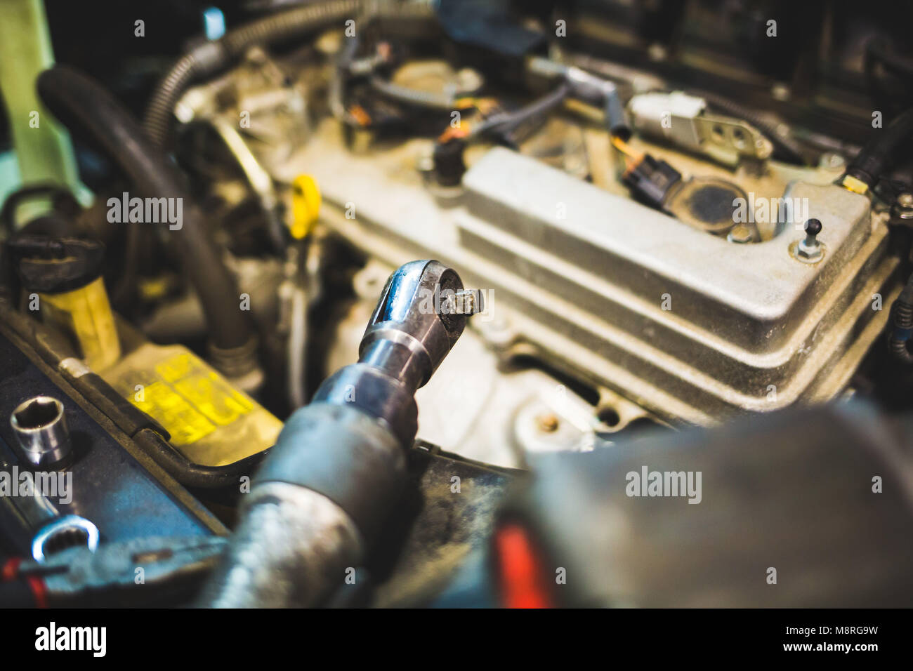 Complex car service equipment repair inside garage Stock Photo - Alamy