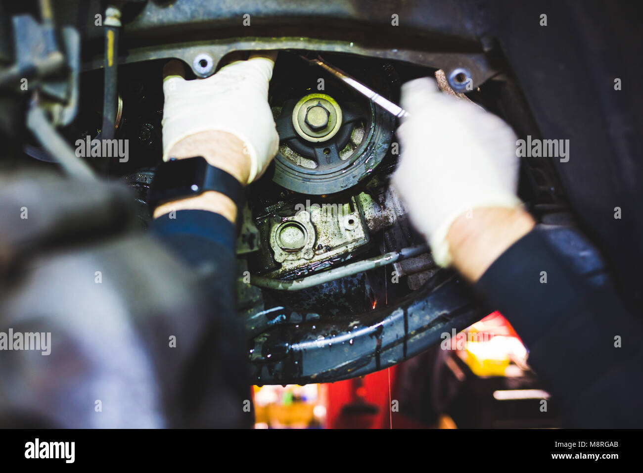 Complex car service equipment repair inside garage Stock Photo - Alamy