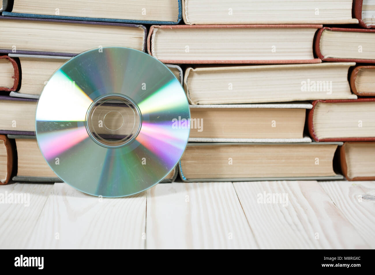 Book with compact disc over white background e book or digital storage ...