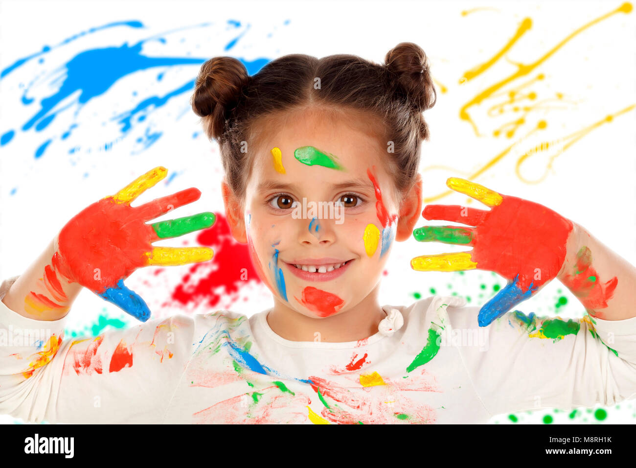 Funny girl with hands and face full of paint isolated on a white ...