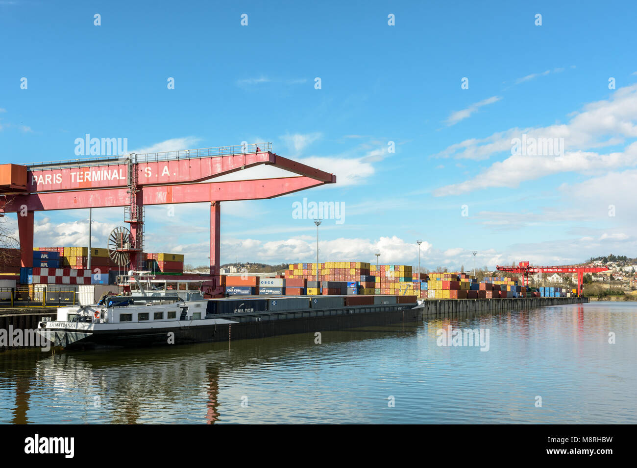 Gennevilliers, France - March 11, 2018: A barge loaded with containers ...