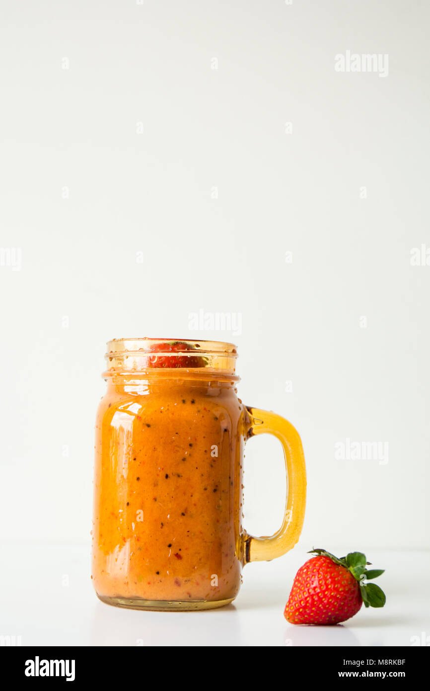 Close-up of smoothie in mason jar against white background Stock Photo ...
