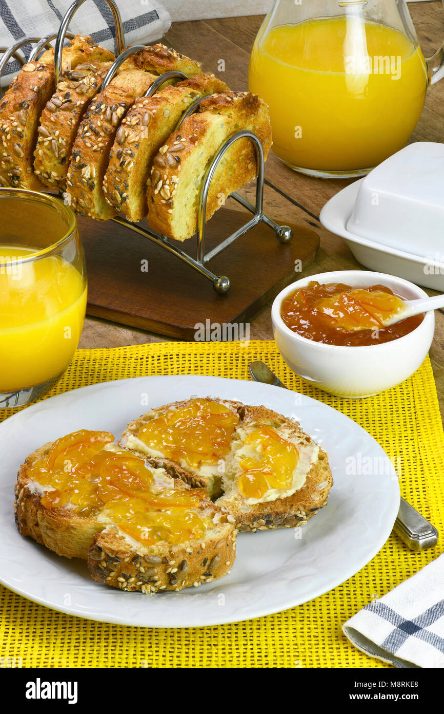 vertical image , breakfast of toast with homemade organic marmalade and ...