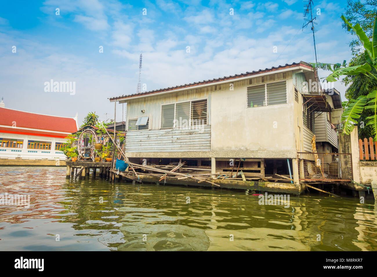 Outdoor view of floating poor house on the Chao Phraya river. Thailand ...