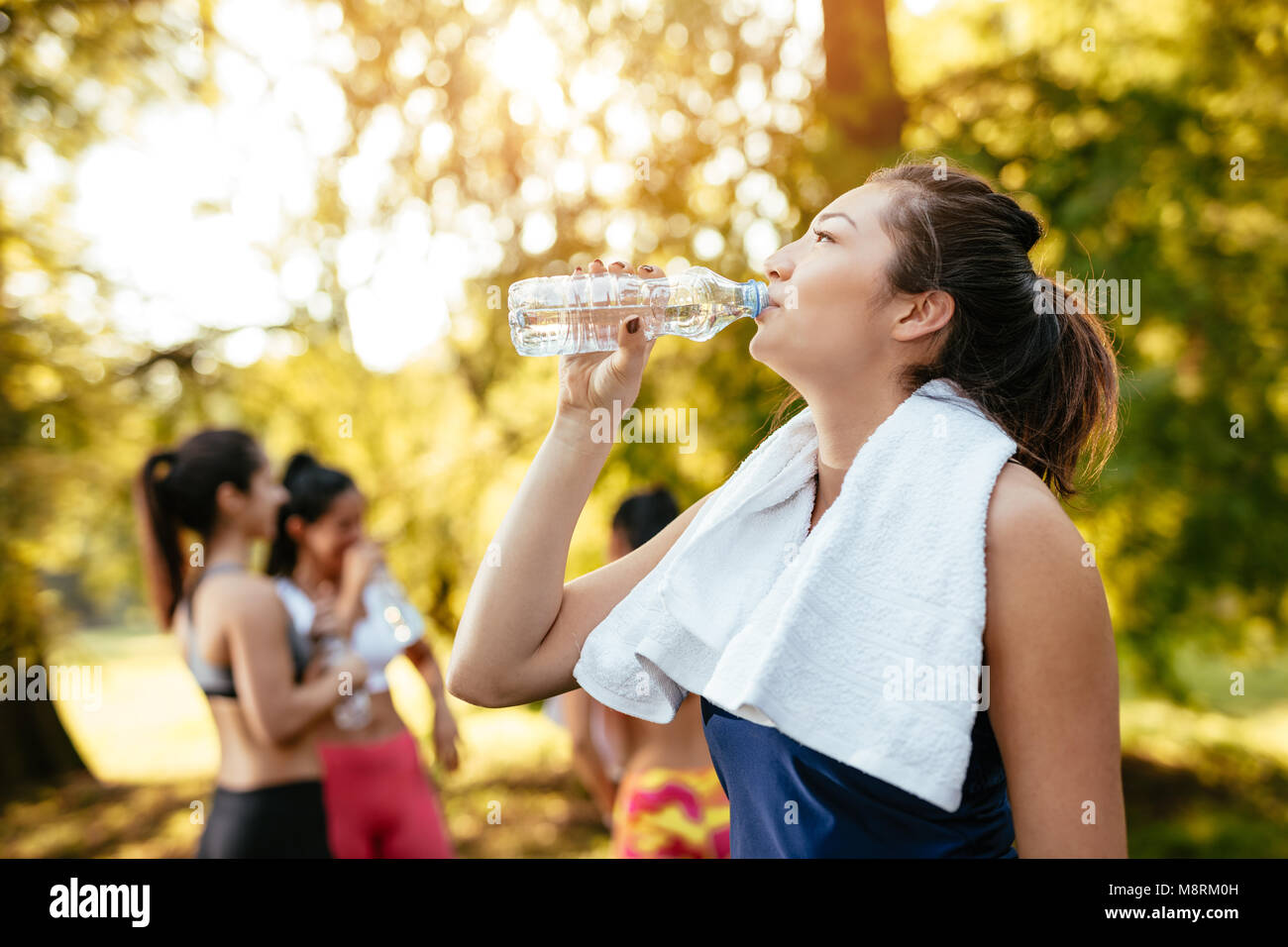 Girl drinking water horizontal ethnic hi-res stock photography and ...