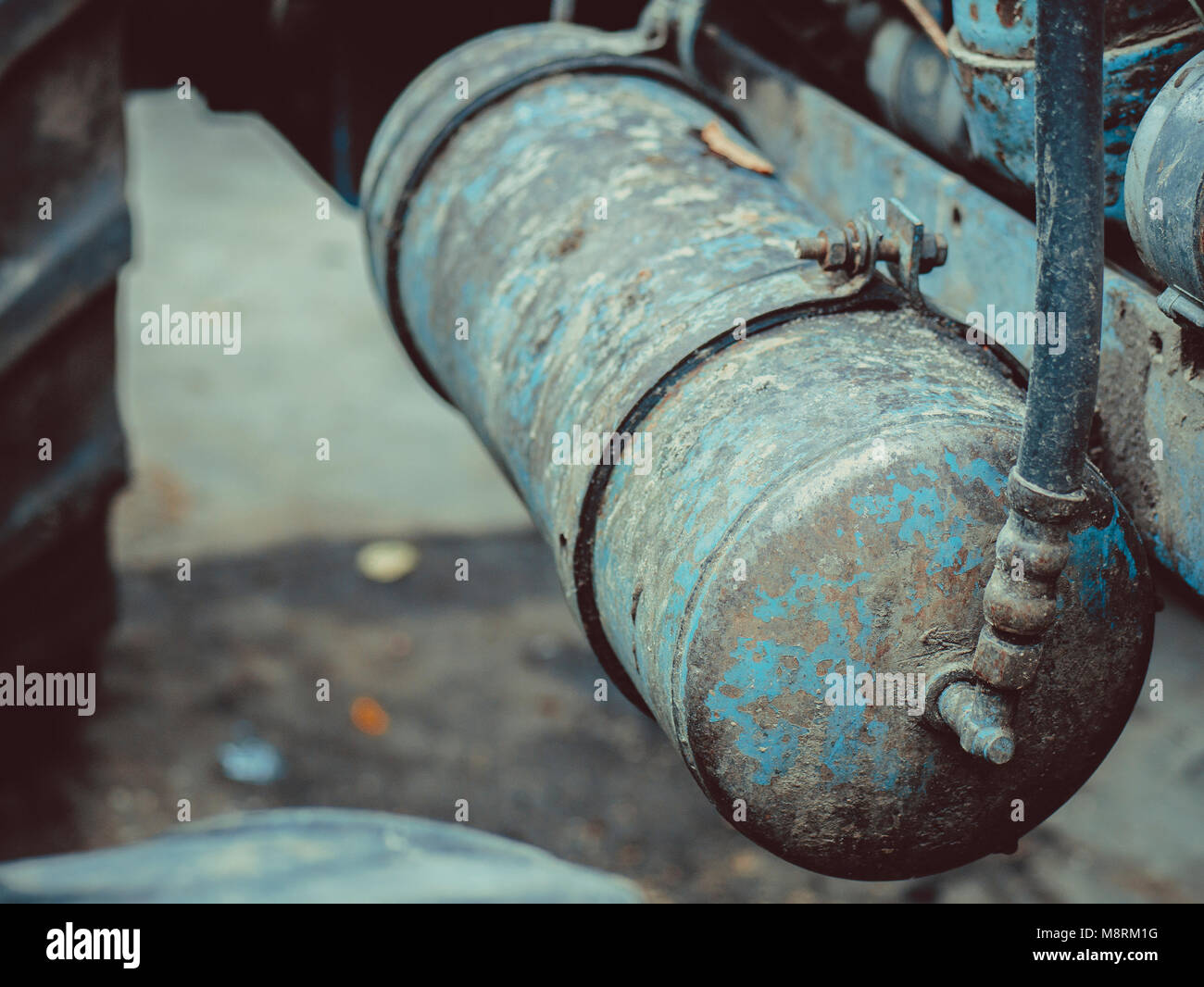 old tractor in blue rusty with details of motor engine and tools Stock ...