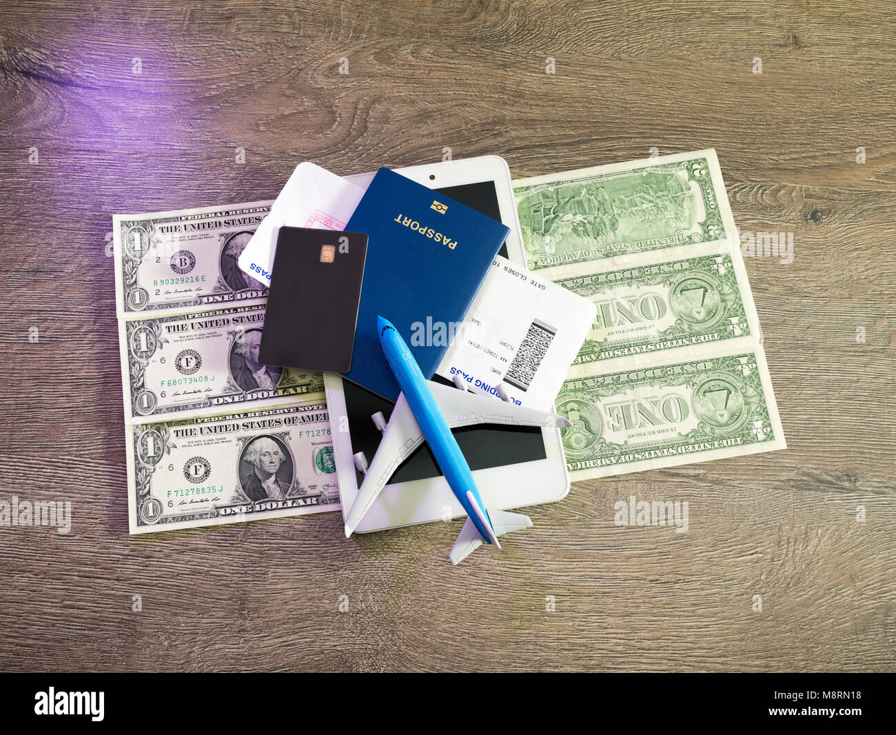 travel concept with tablet, credit cards and flight tickets on dark ...