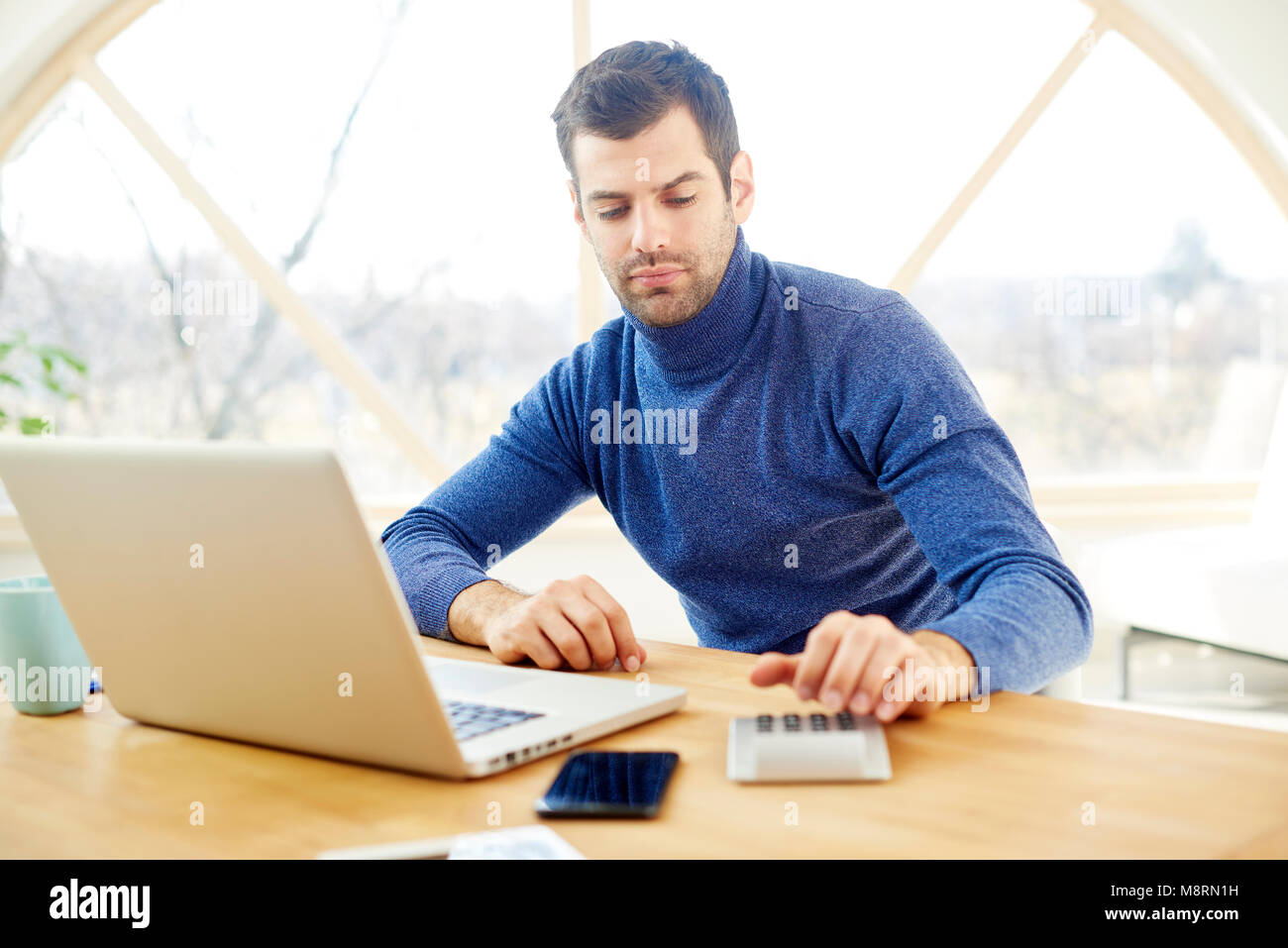 Man men male using calculator hi-res stock photography and images - Alamy
