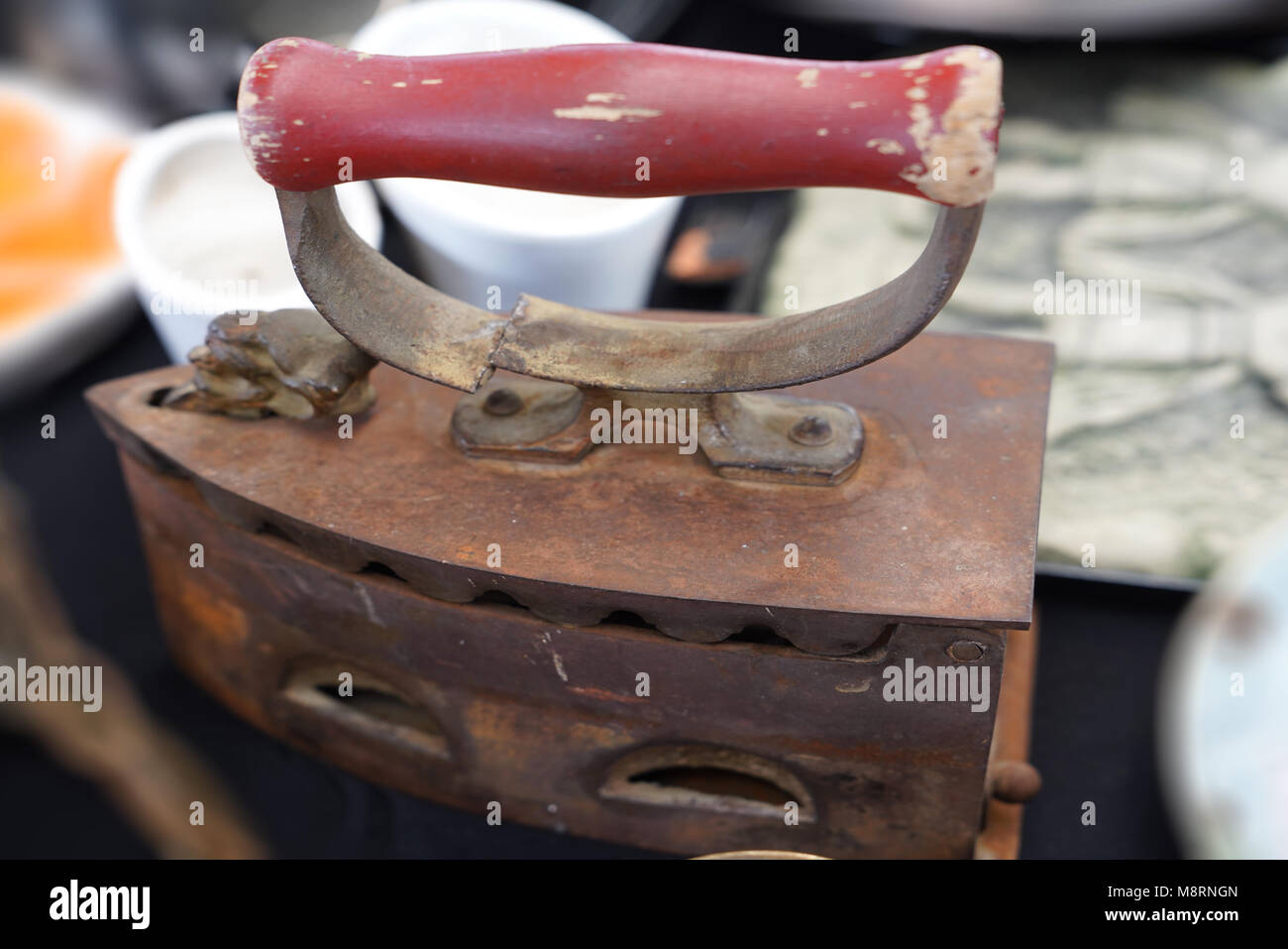 Old rusty iron on the table Stock Photo - Alamy