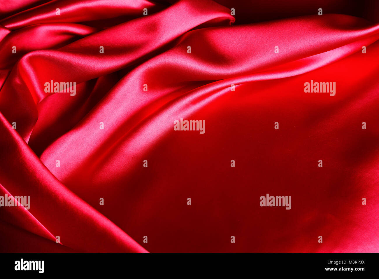 Closeup of ripples in red silk fabric Stock Photo - Alamy