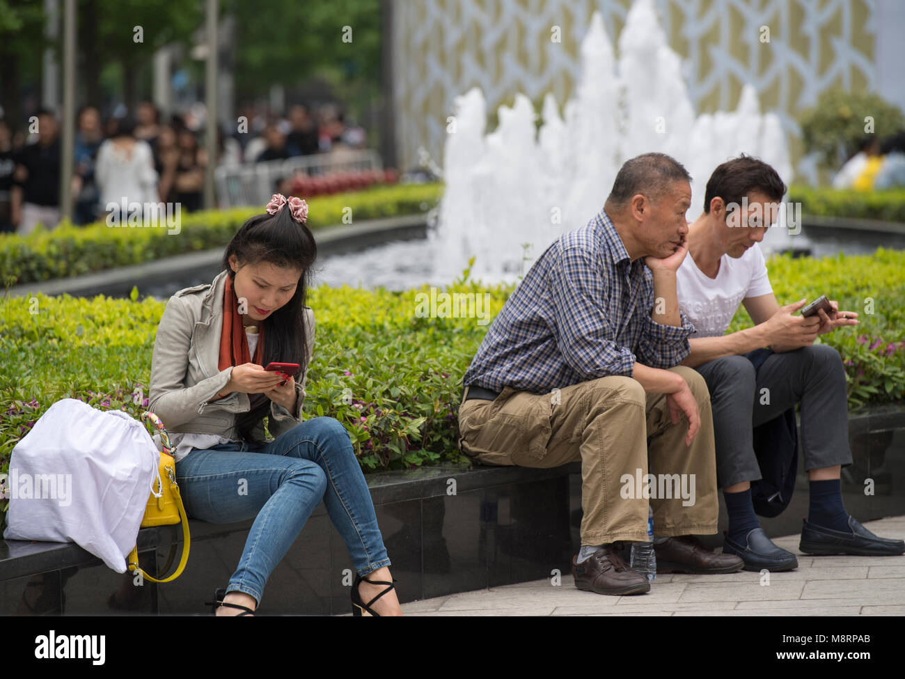 People using their mobile phones in Shanghai, China Stock Photo - Alamy